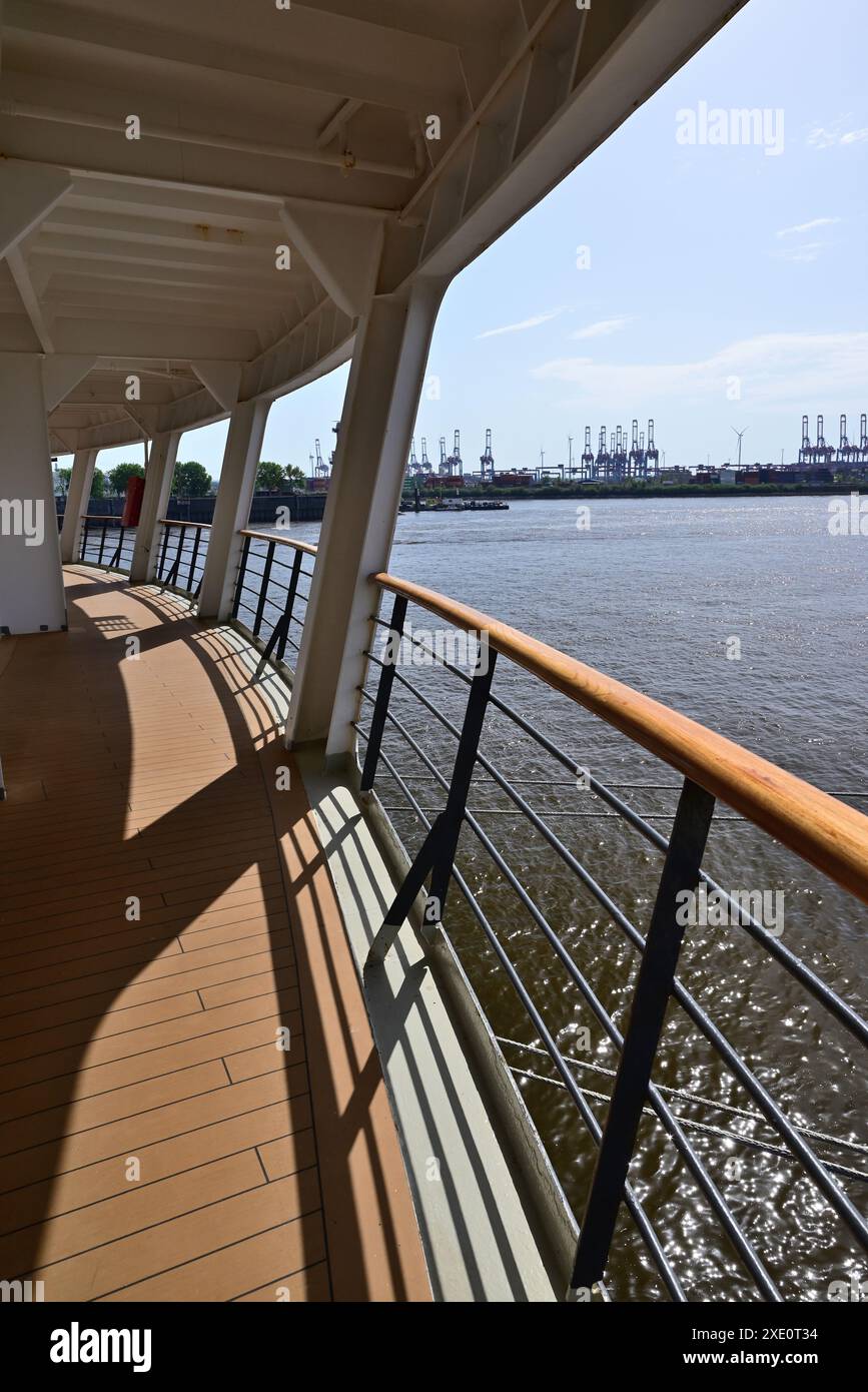 Dockside cranes in Hamburg, seen from the promenade deck at the stern ...