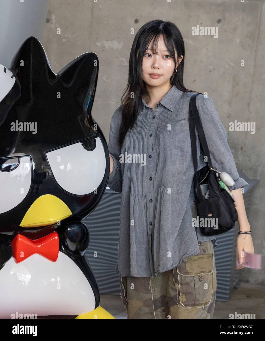 Korean woman posing with Sanrio character, Hello Kitty 50th-Anniversary ...