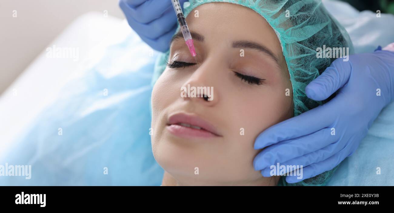 Beautician gives woman rejuvenating injection into skin of face Stock ...