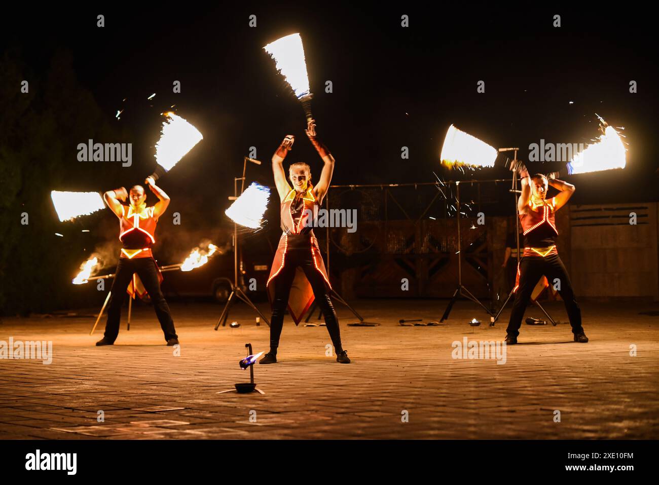 Fiery pieces of a fire show Stock Photo - Alamy