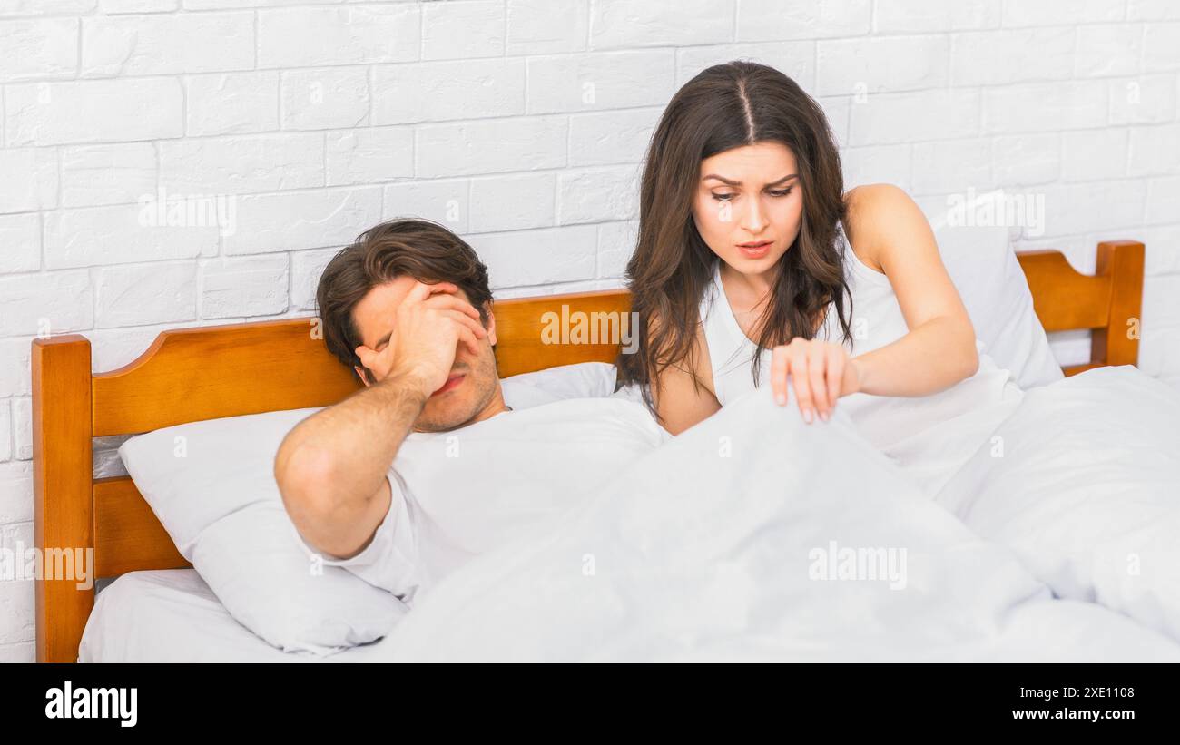 Man woman bed awkward hi-res stock photography and images - Alamy