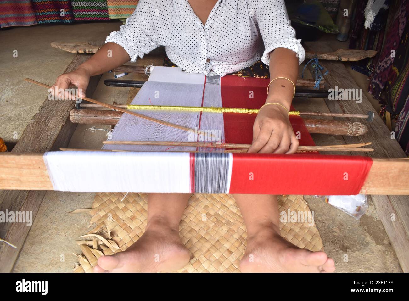 learn to weave traditional cloth typical of the Sasak tribe in Sade Village, Lombok, West Nusa ...