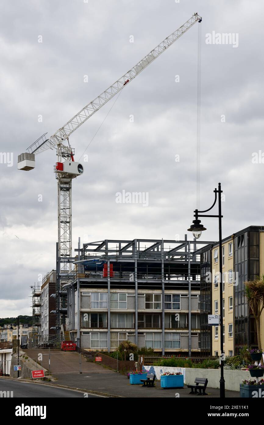 Tower Crane working on Building at Seaton Devon England uk Stock Photo ...