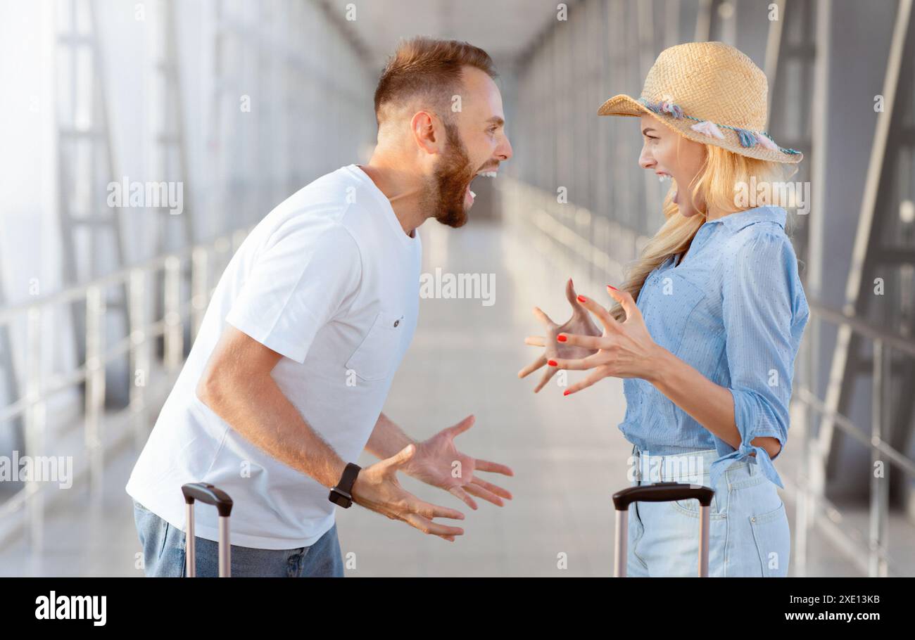 Young tourists arguing, arriving at airport, side view Stock Photo - Alamy