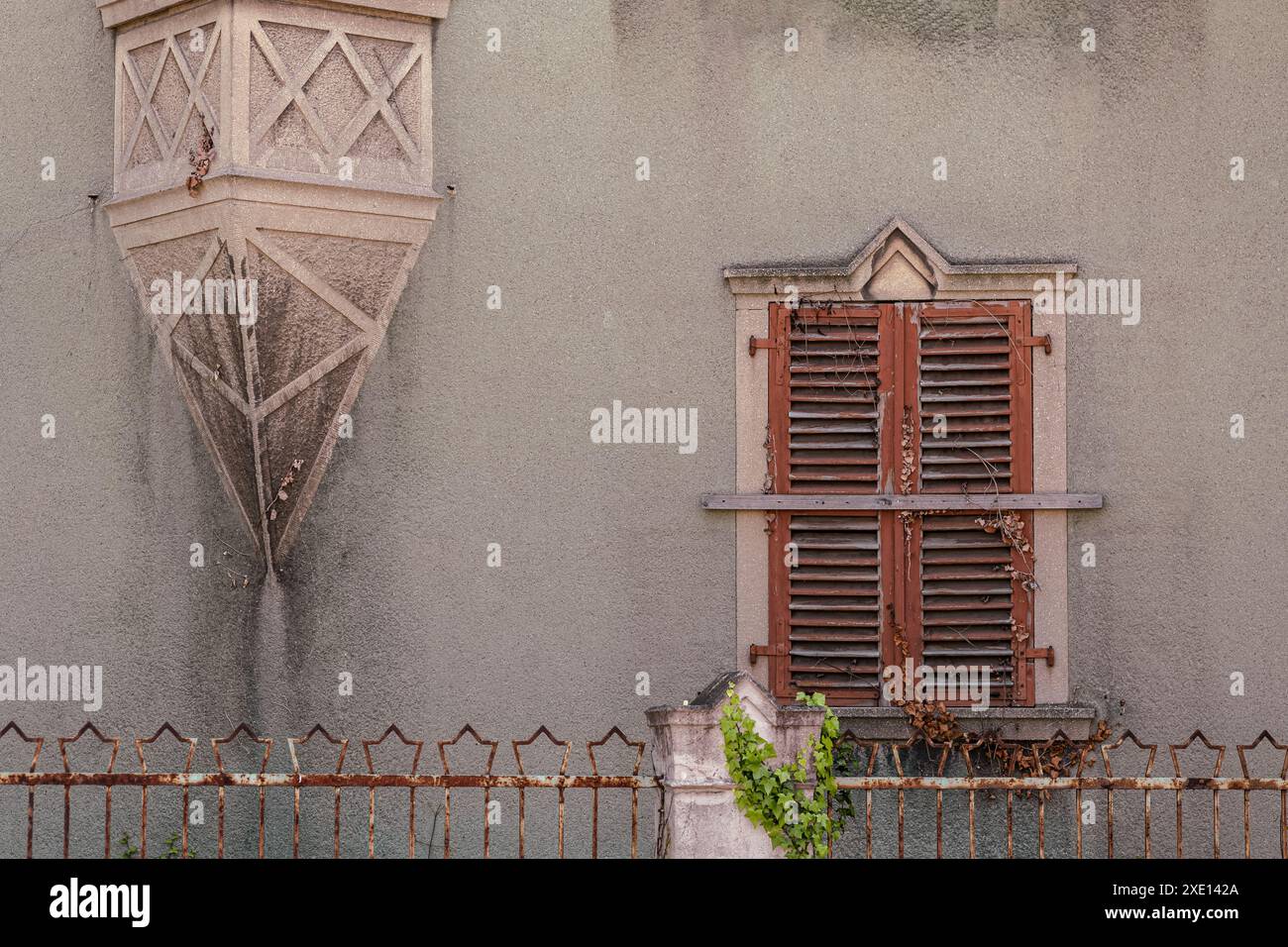 A closed wooden shutter on the wall of a house Stock Photo - Alamy