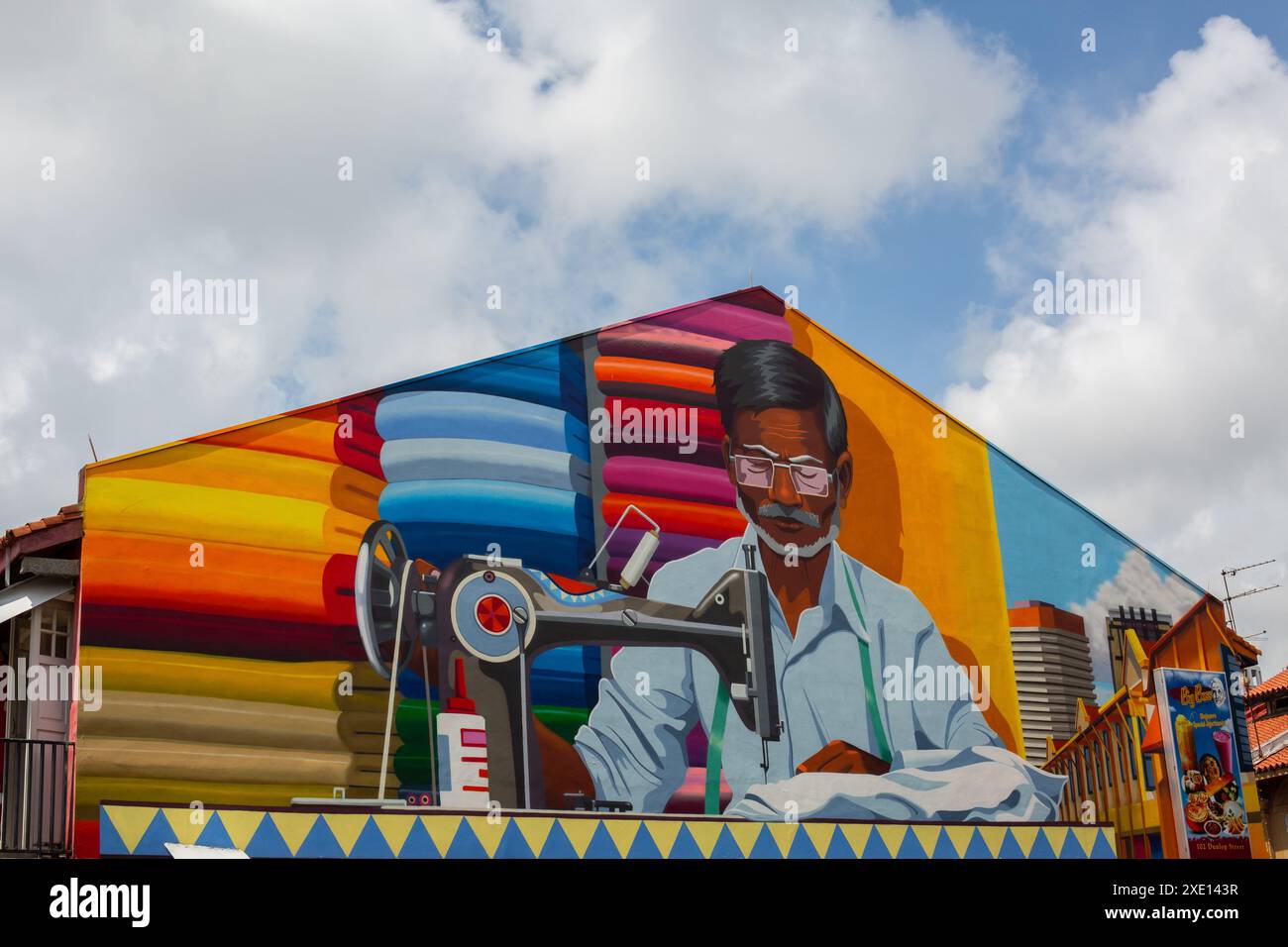 Colourful picture wall mural of an Indian man doing sewing work ...