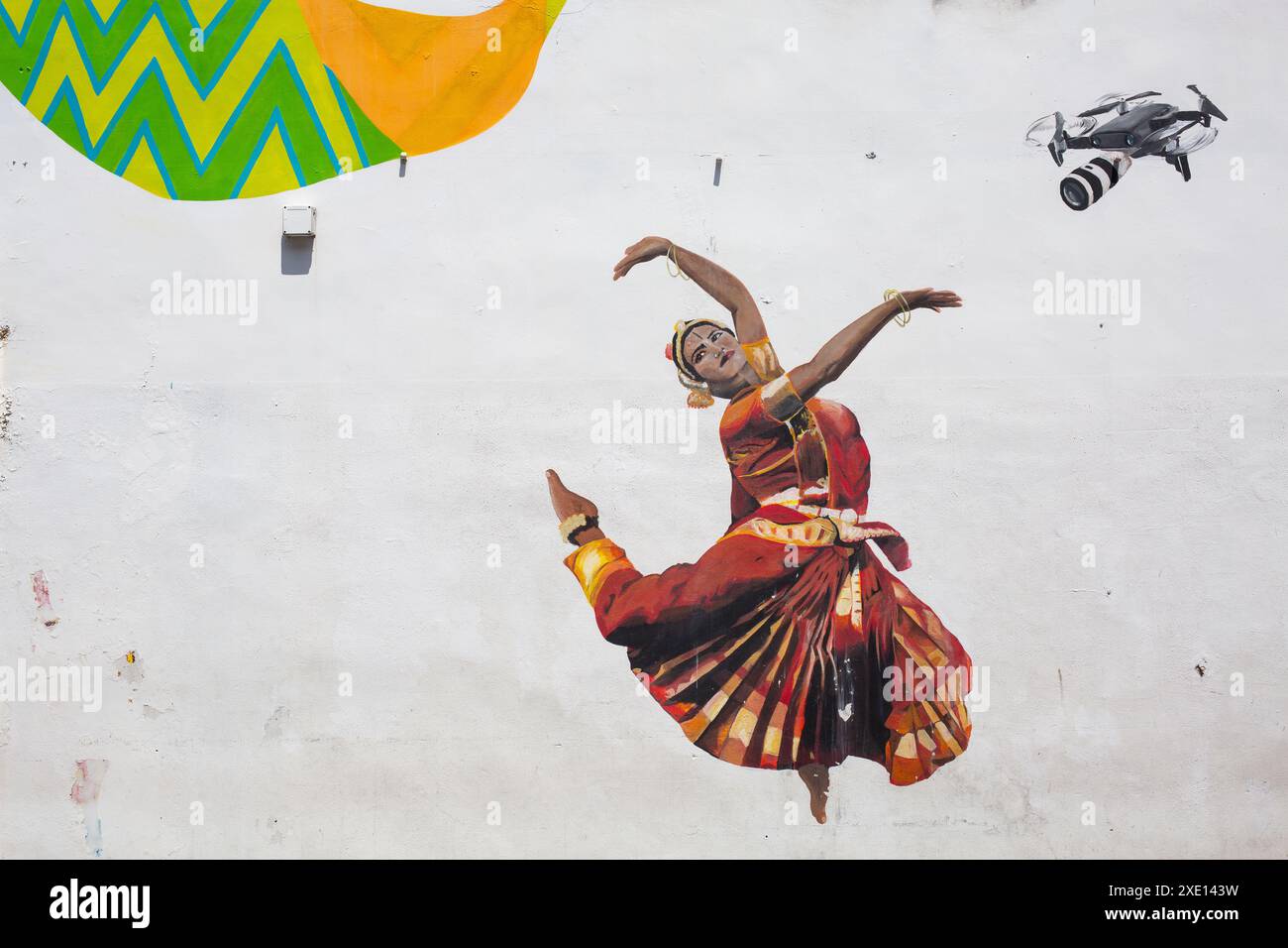 Colourful wall mural of an Indian lady dancer leaping up gracefully ...