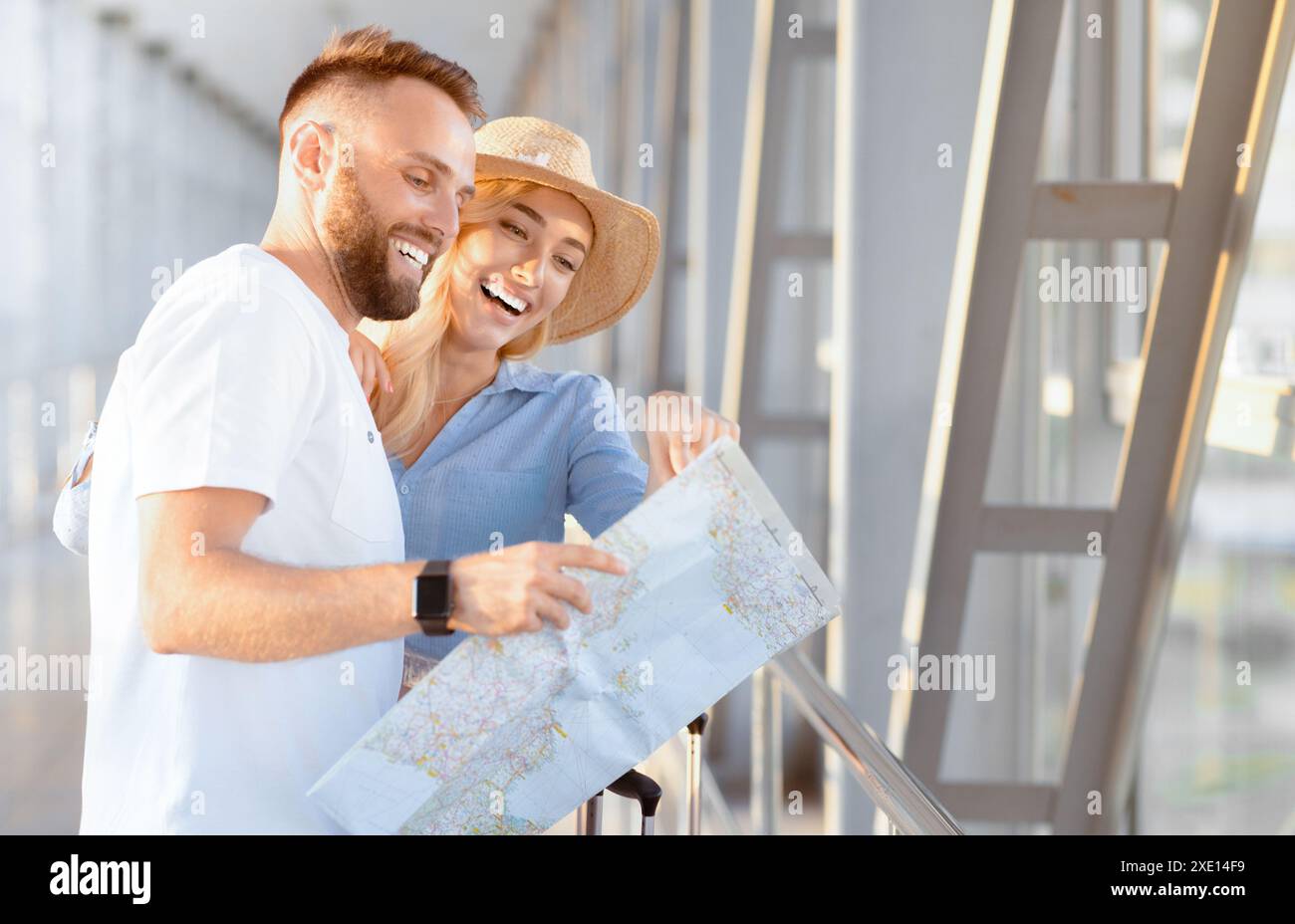 Happy couple observing map hi-res stock photography and images - Alamy