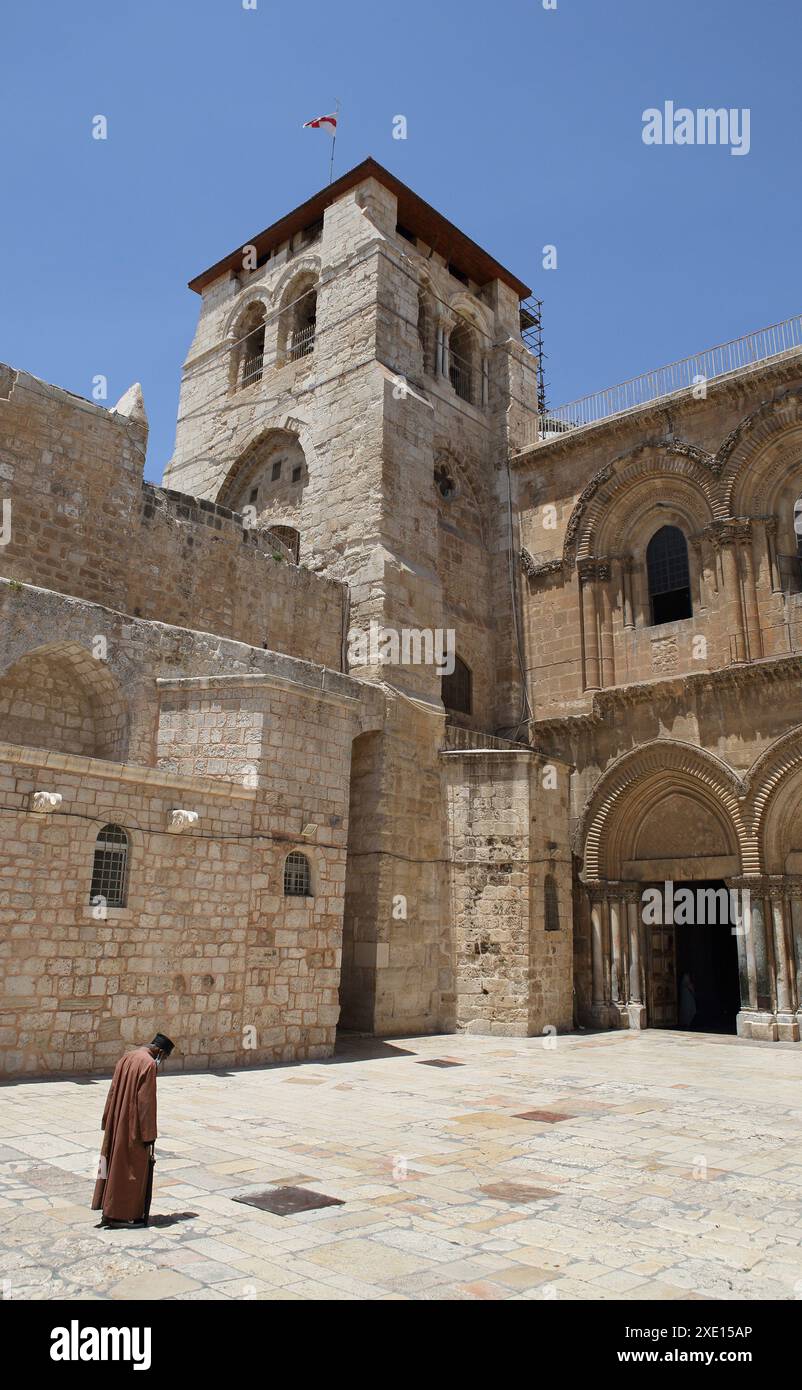 Ethiopian monk bows and meditates in prayer in front of the main ...