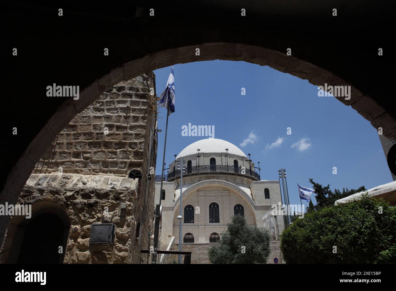 Hurva Synagogue with it's white dome and Israeli flags around in Old ...