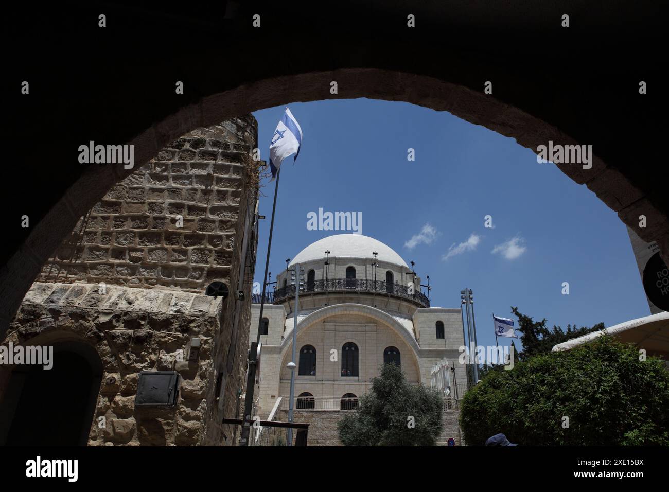 Hurva Synagogue with it's white dome and Israeli flags around in Old ...