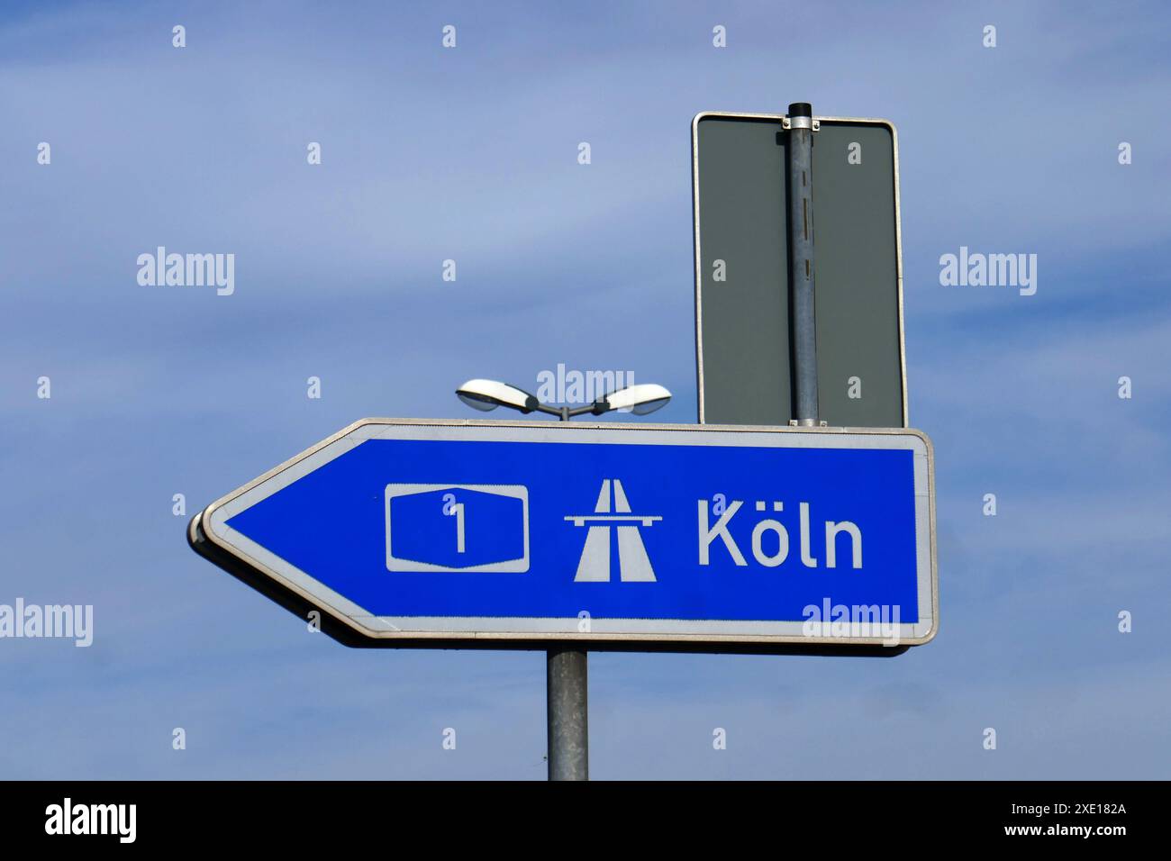 Arrow sign on the Autobahn in the direction of Cologne Stock Photo - Alamy