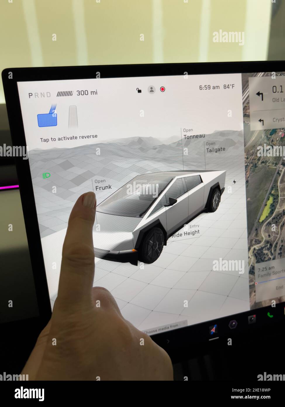 Interacting with Tesla Cybertruck Touchscreen Interface Stock Photo - Alamy