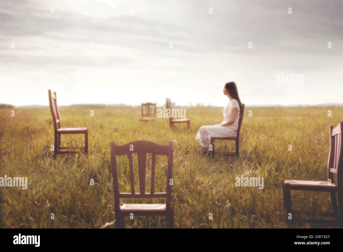surreal woman sitting on a chair in the middle of the field surrounded ...