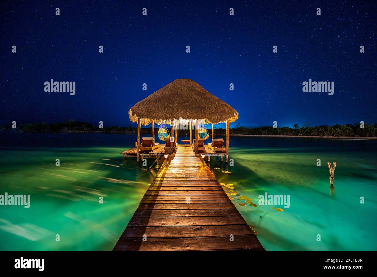 Tropical Resort in the Lagoon by night Stock Photo - Alamy