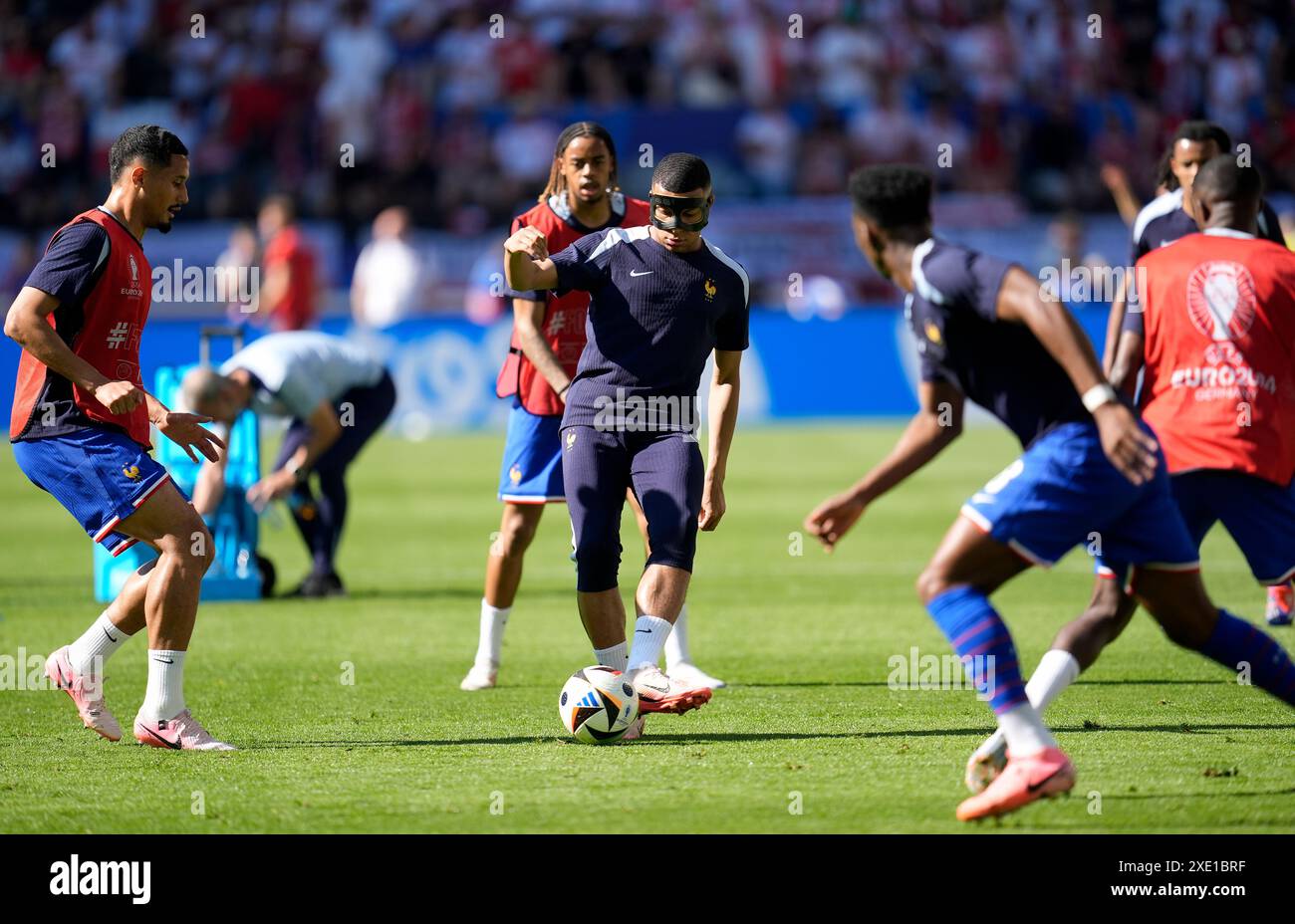 France's Kylian Mbappe (centre) warms up ahead of the UEFA Euro 2024 Group D match at BVB ...