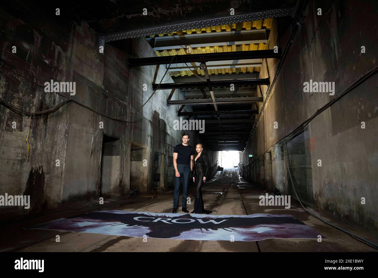 Bill Skarsgard, left, and FKA Twigs pose for photographers upon arrival ...