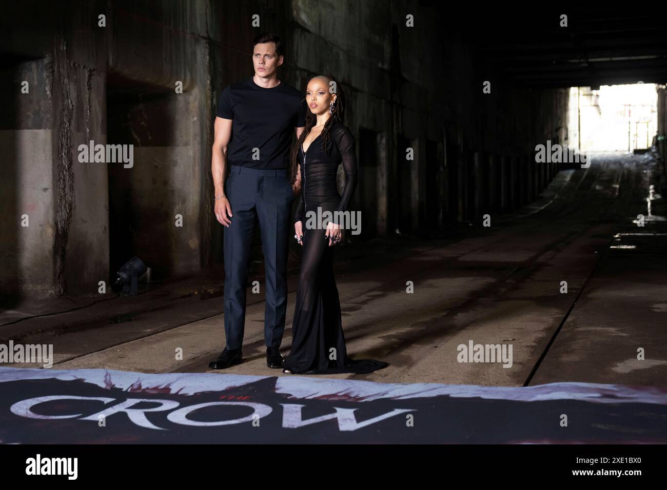Bill Skarsgard, left, and FKA Twigs pose for photographers upon arrival ...