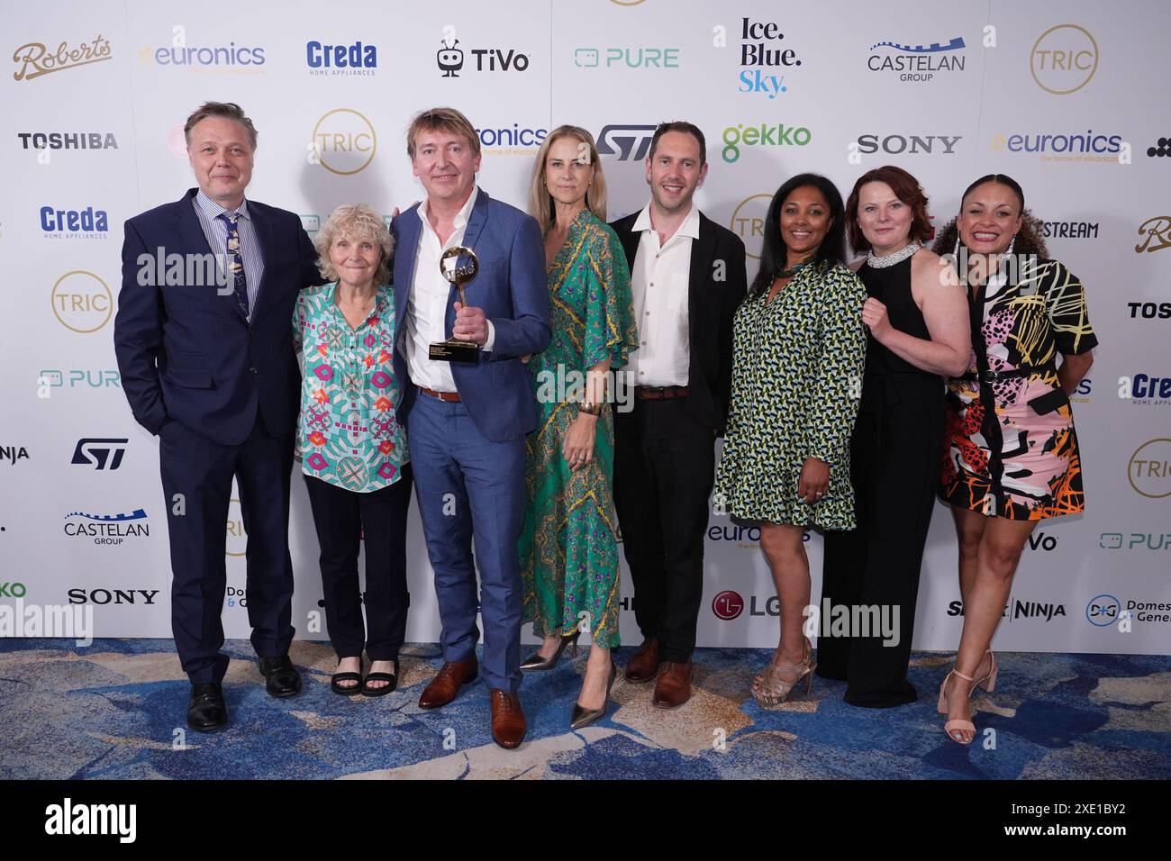 Former postmistress Jo Hamilton (second left) poses with cast members ...