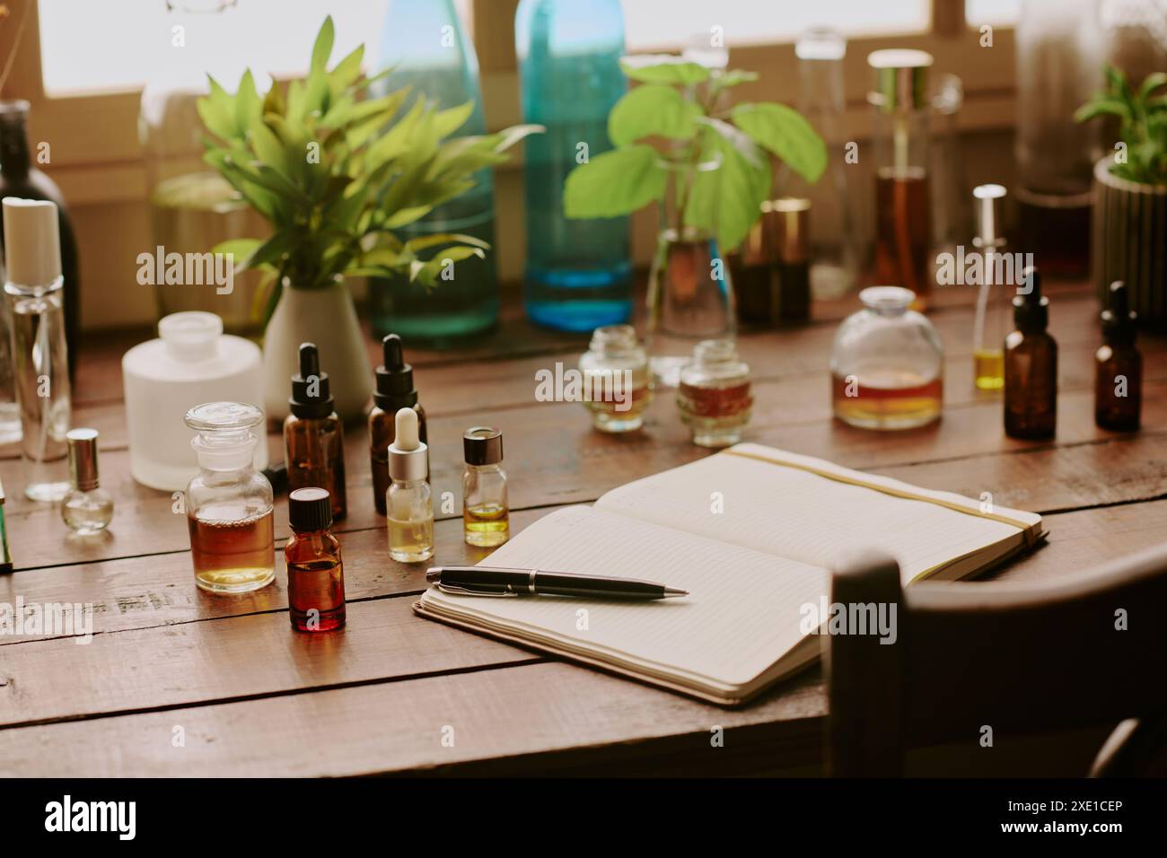 Medium close up of wooden table with small bottles with perfume and ...