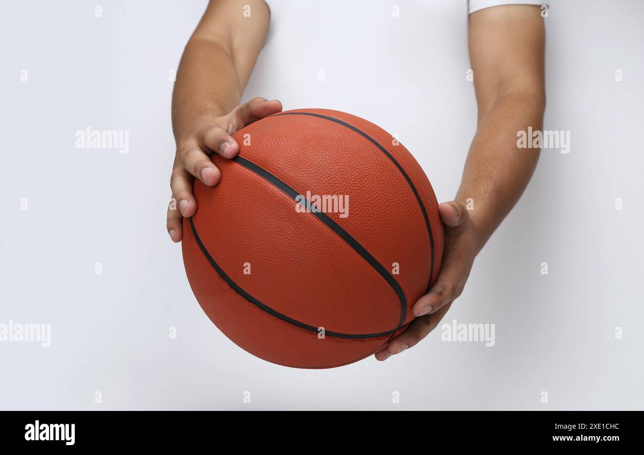 Isolated basketball in hand hi-res stock photography and images - Alamy
