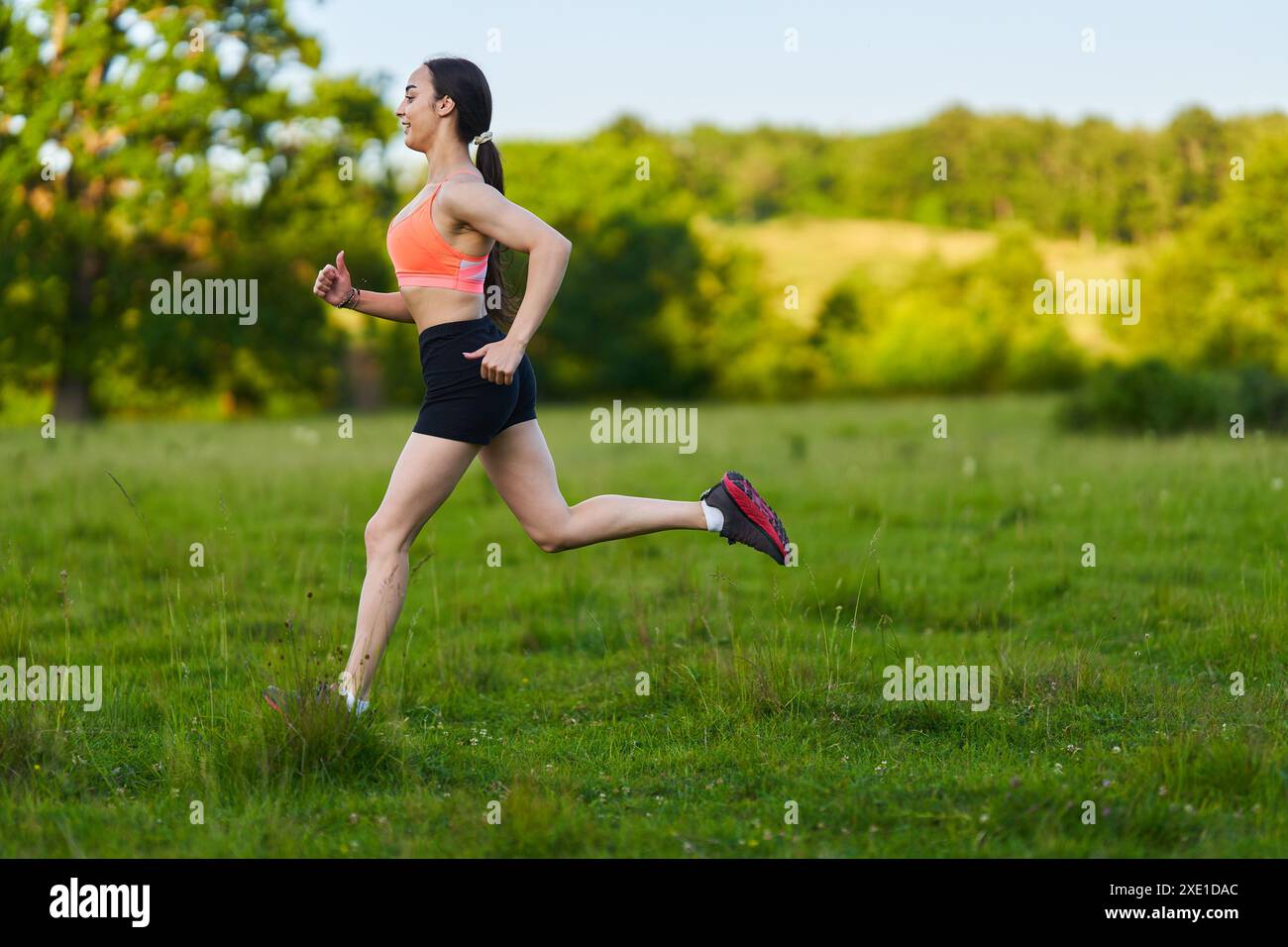 Young fitness Hispanic girl running on a trail in the forest Stock ...