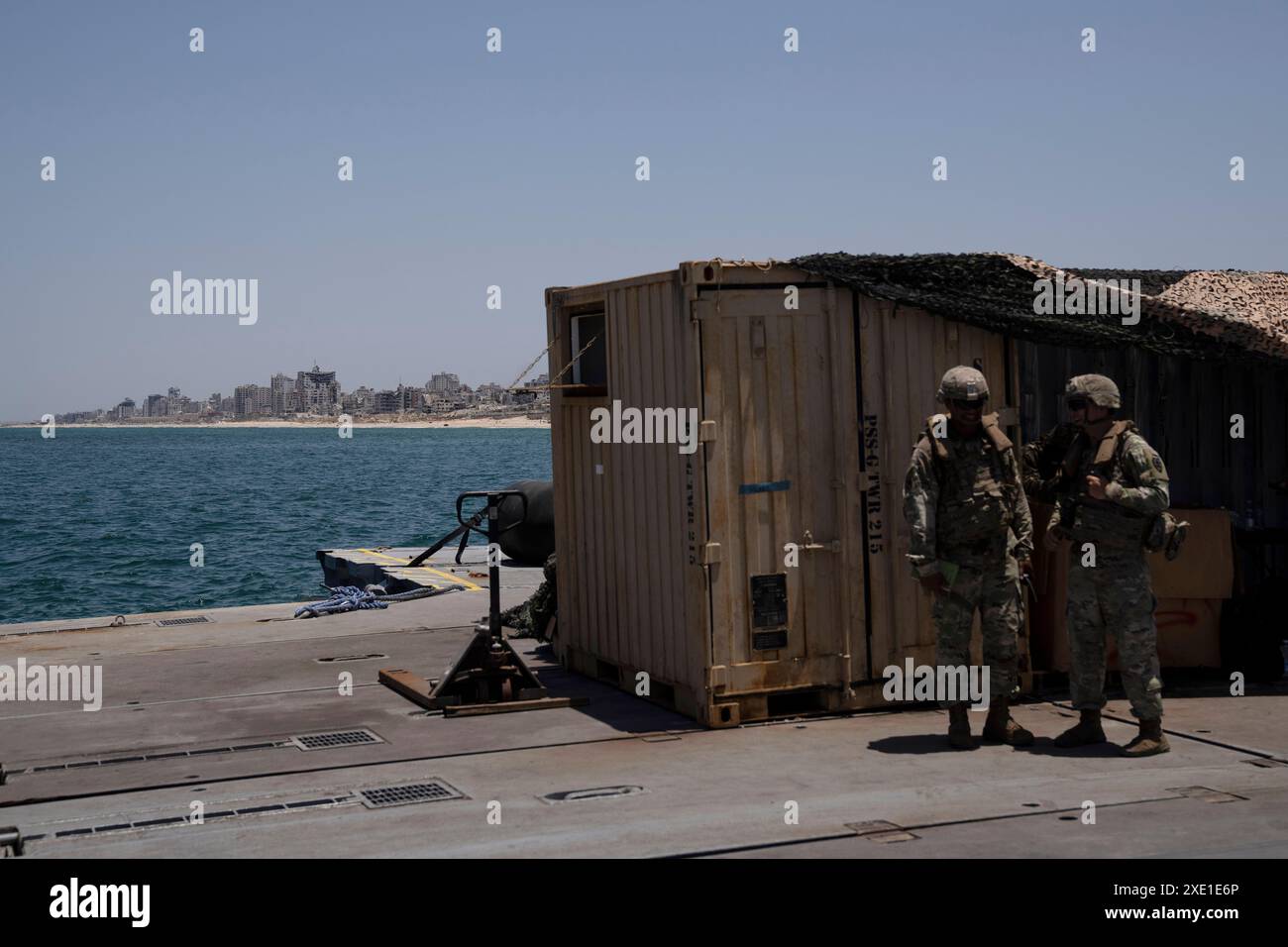 U.S. Army soldiers stand at the U.S.-built floating pier Trident ...