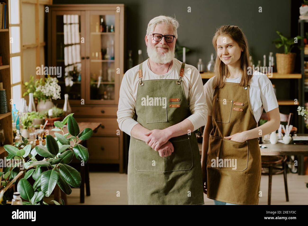 Senior experienced perfumer crossing his arms and smiling widely and ...