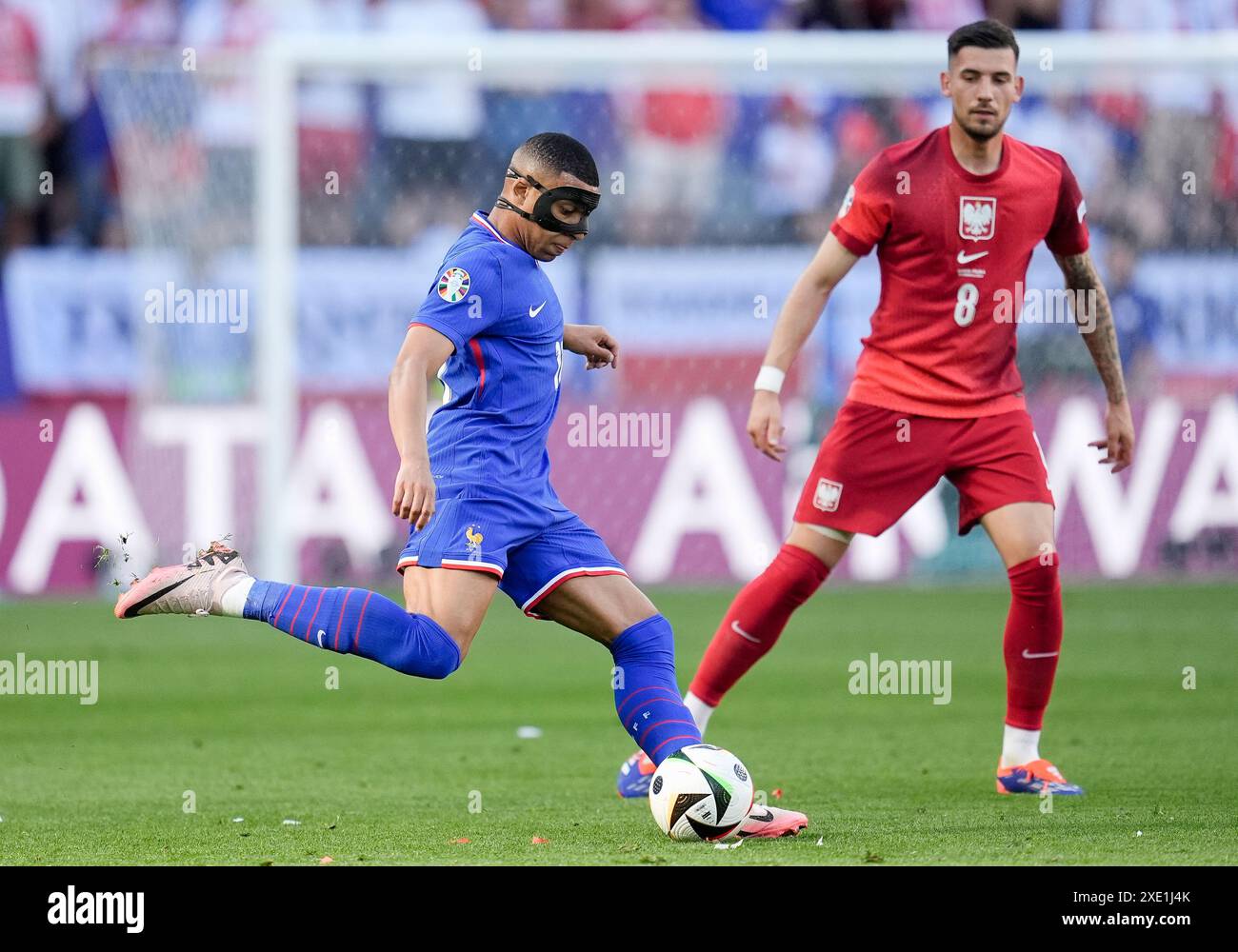France's Kylian Mbappe (left), wearing a Black Mask after breaking his ...