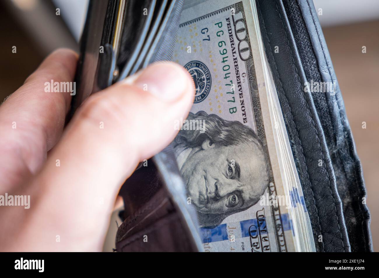 Counting dollars man hand close hi-res stock photography and images - Alamy