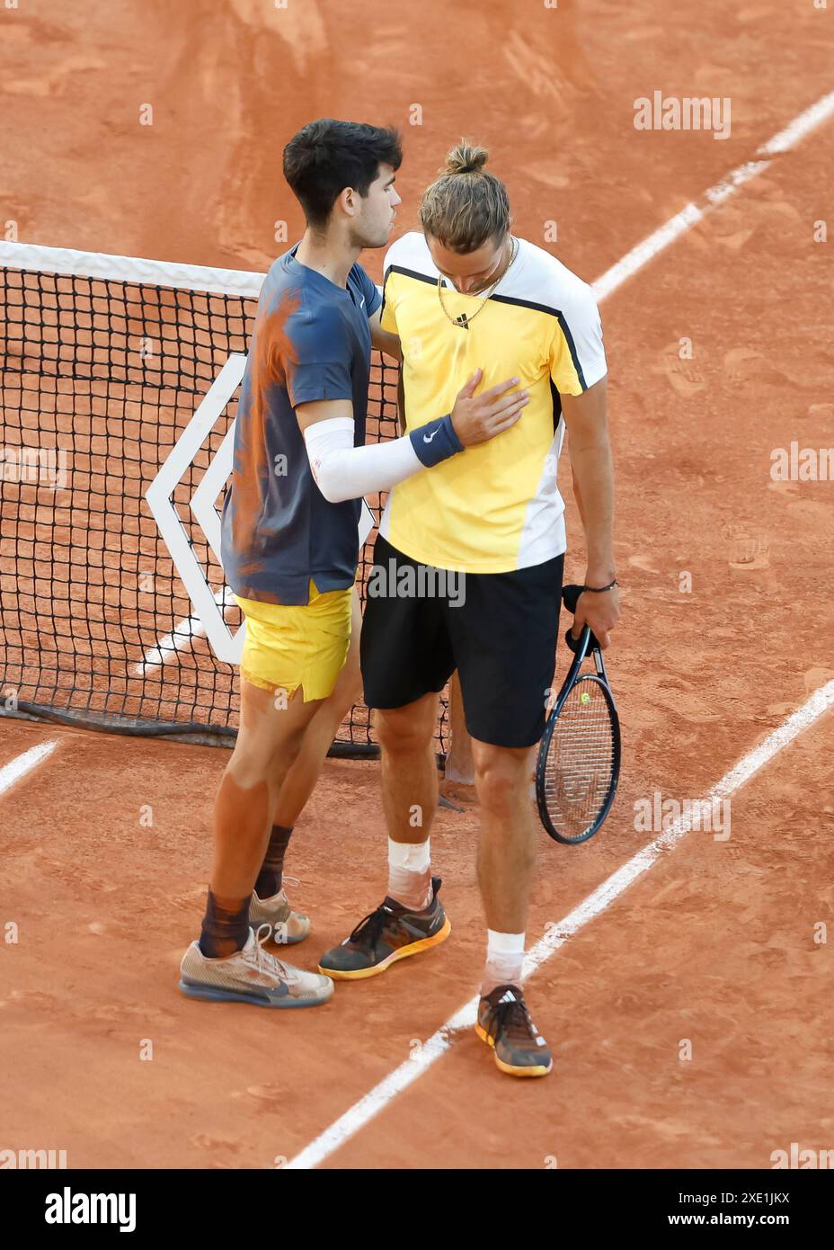 Spanish tennis player Carlos Alcaraz consoling his opponent Alexander ...