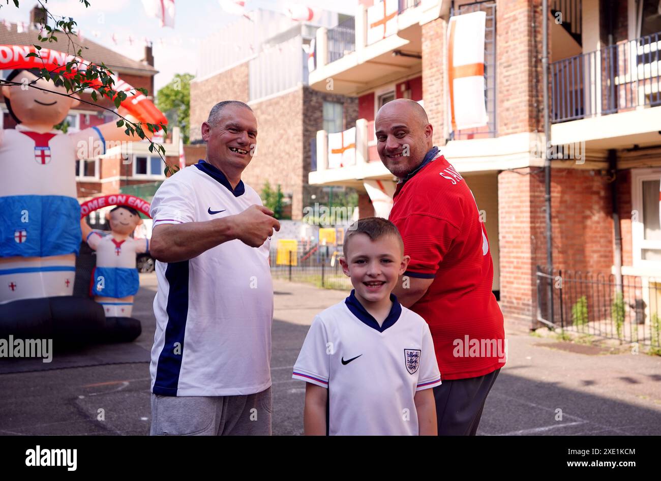Residents of the Kirby Estate, London. England will face Slovenia later ... Residents of the Kirby Estate, London. England will face Slovenia later ...