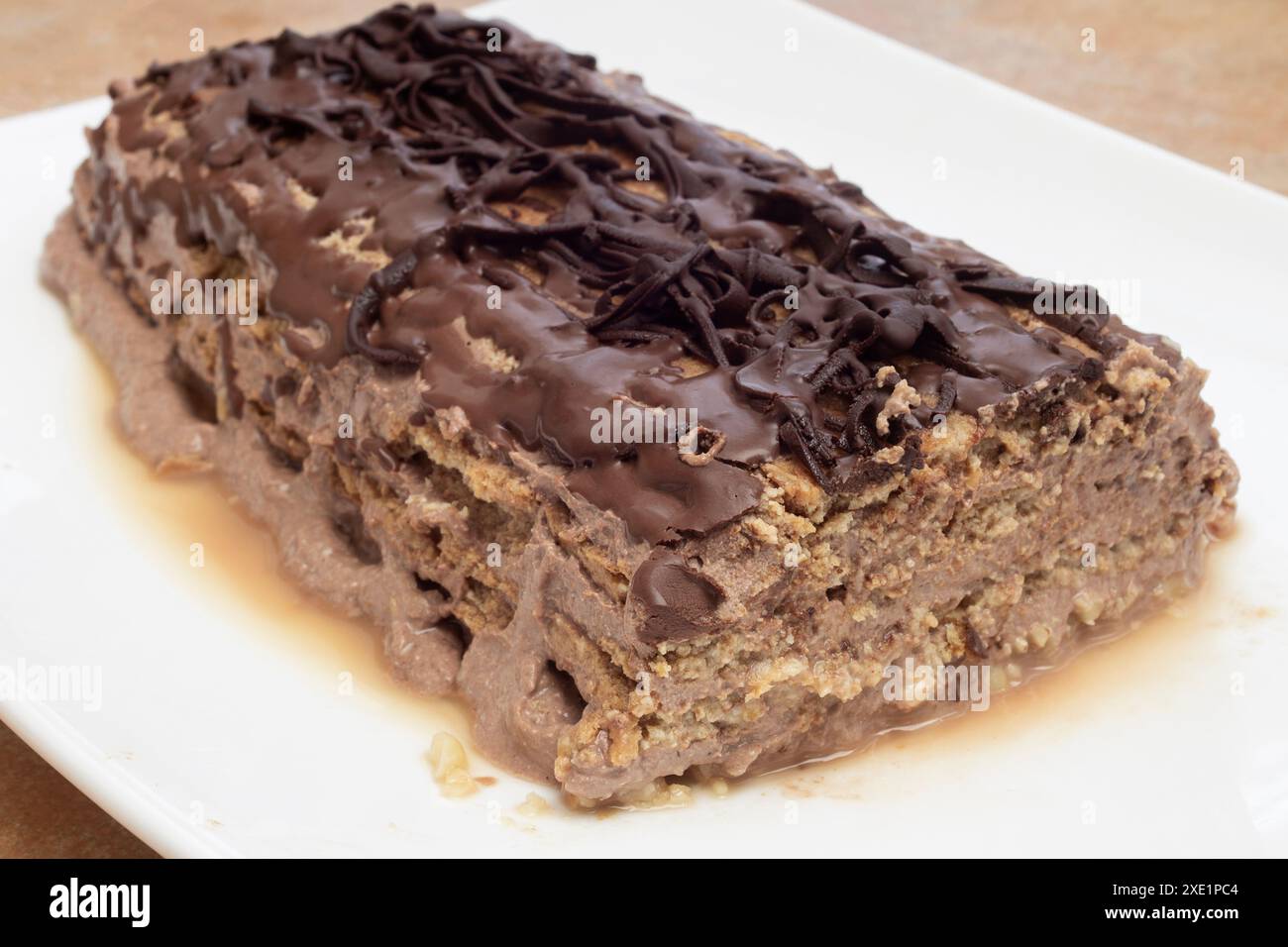 Close up of a decadent chocolate drizzled cookie cake . A missing slice ...