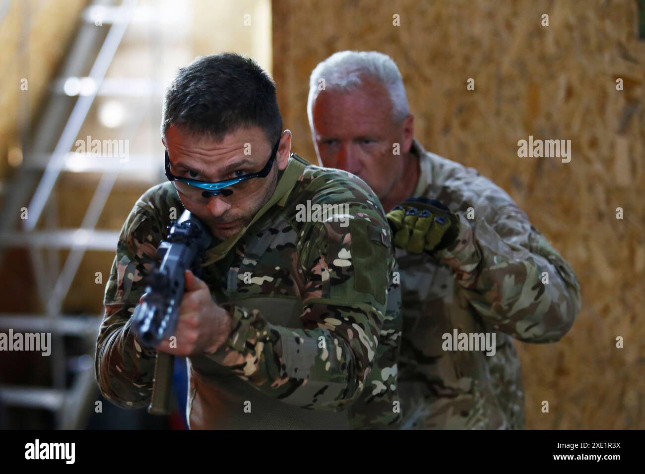 A Ukrainian civilian seen preparing to shoot a target during the ...