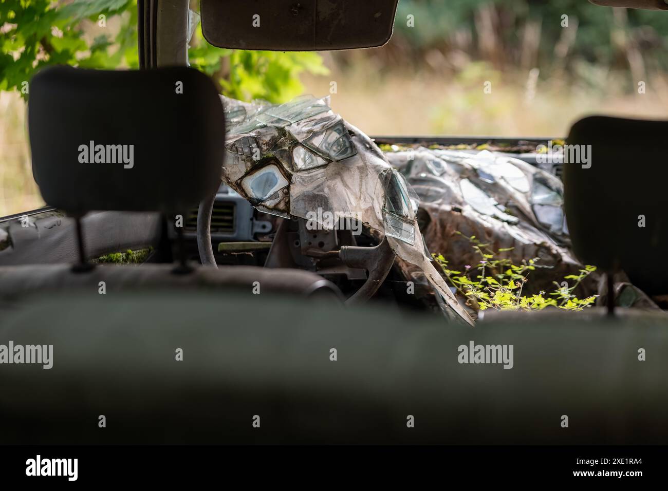 A car cabin after an accident with a broken windshield Stock Photo - Alamy