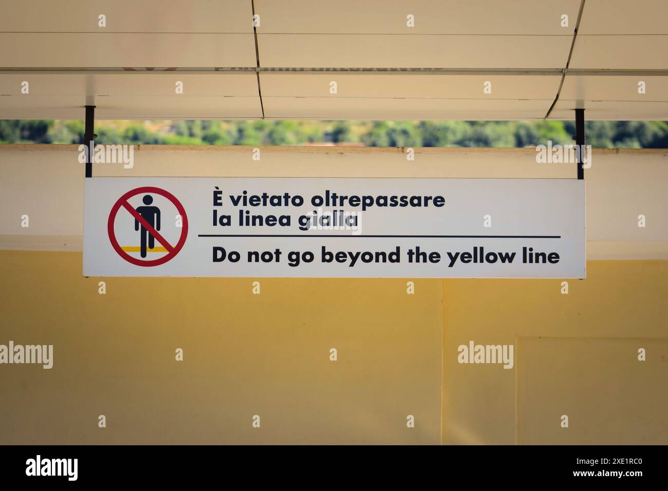 Warning sign at a train station in Italy, stating "Do not go beyond the ...