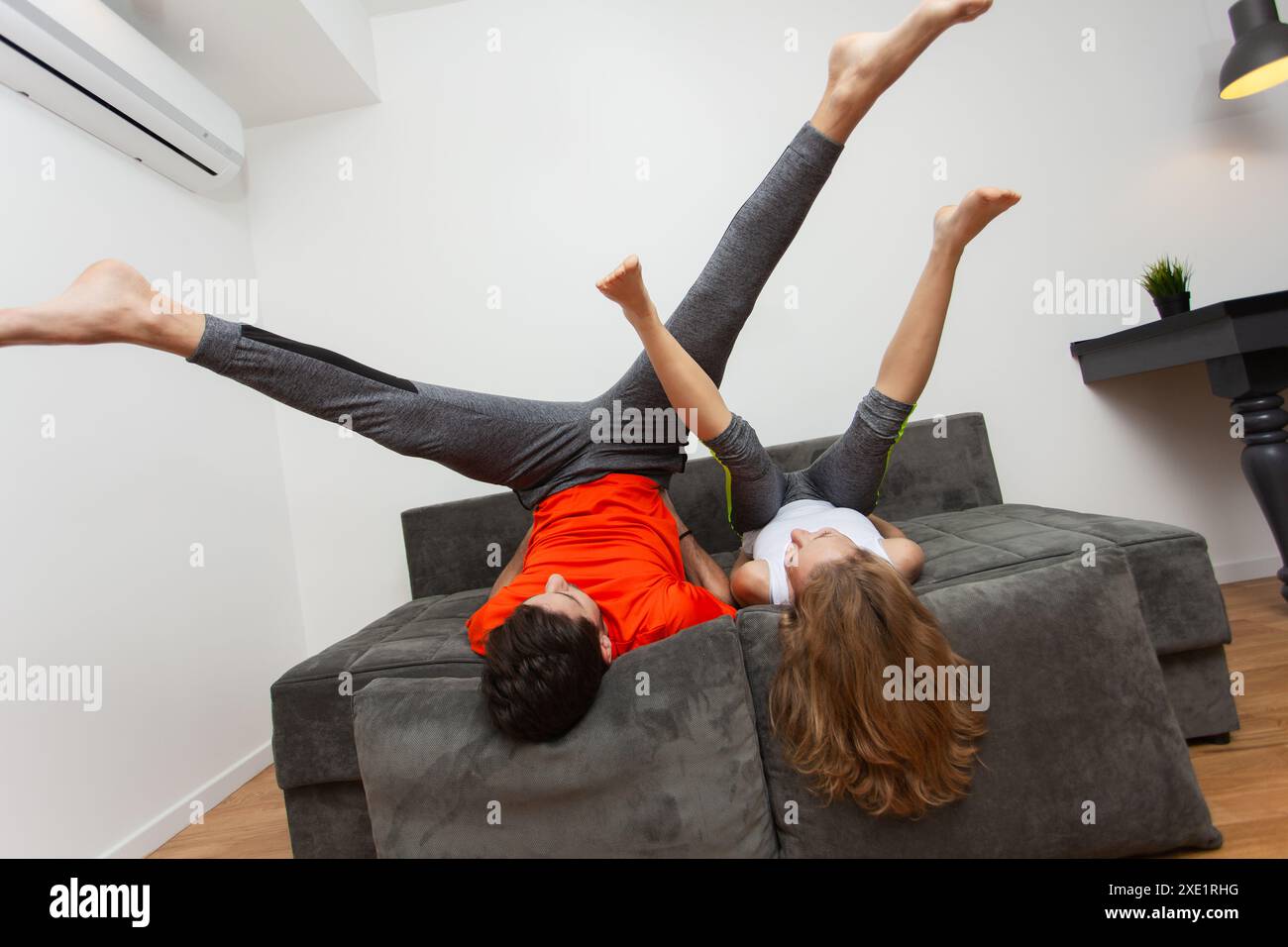 A young couple enjoys a playful and energetic moment while practicing ...