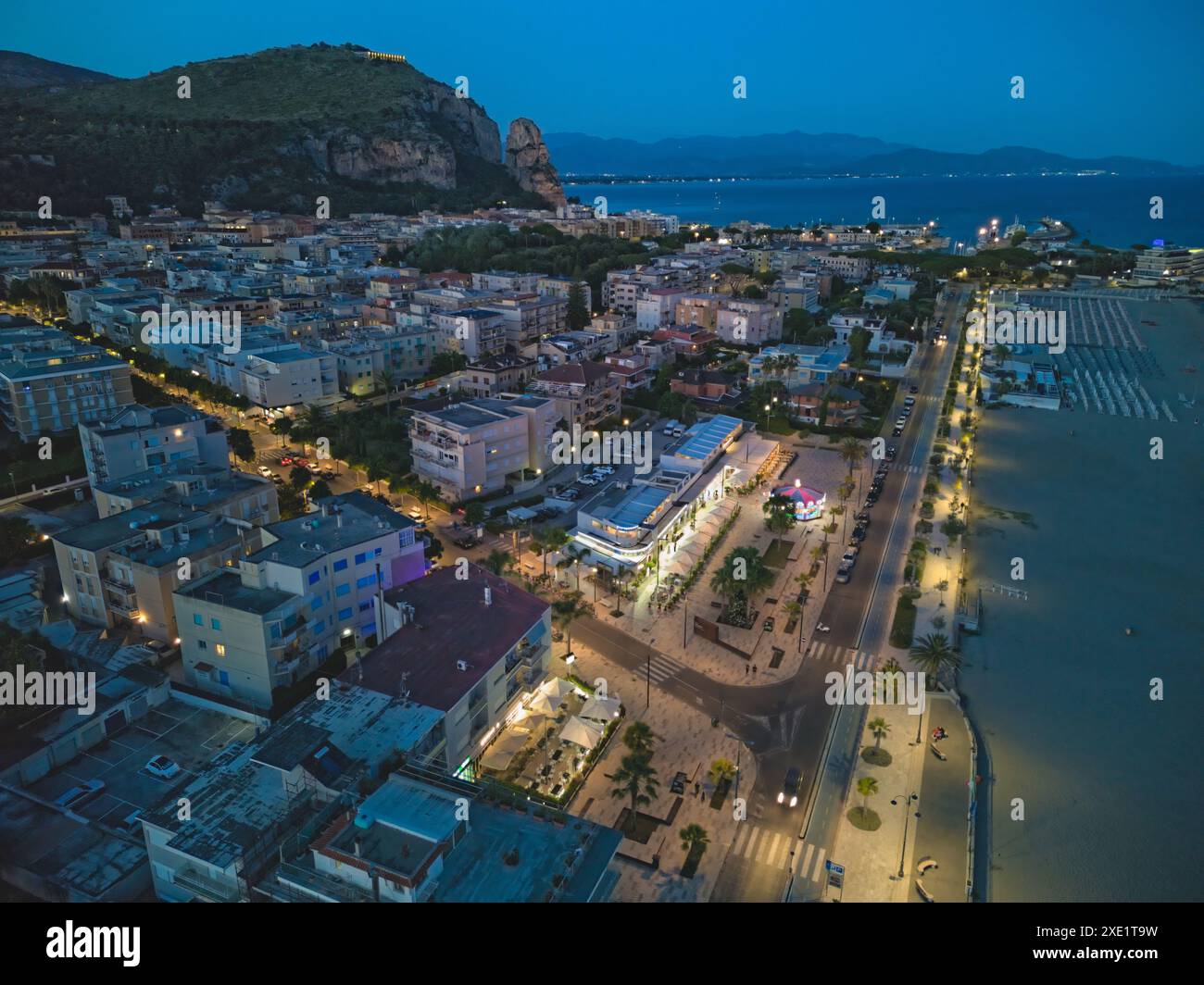 Beaches of Terracina, Italy, at dusk. The Roman temple of Jupiter can ...