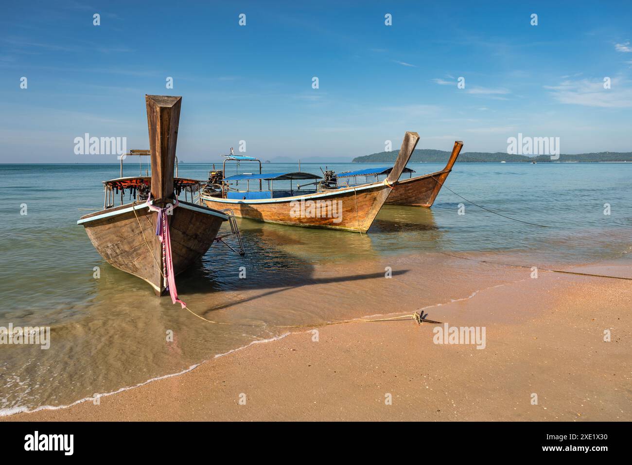 Tropical islands view with long tail boat ocean blue sea water and ...
