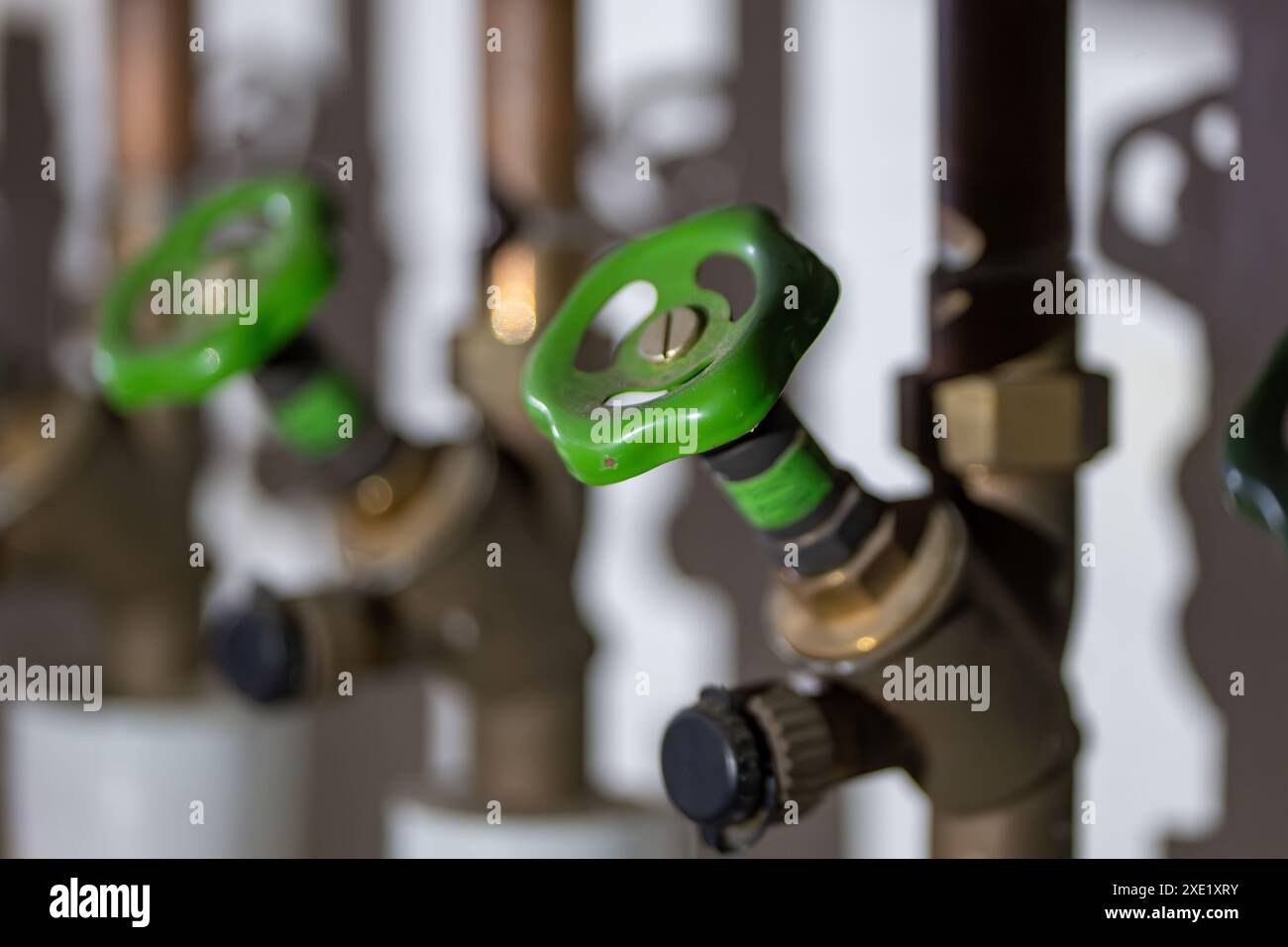 old heating pipes with rotary valve in a dilapidated house Stock Photo ...