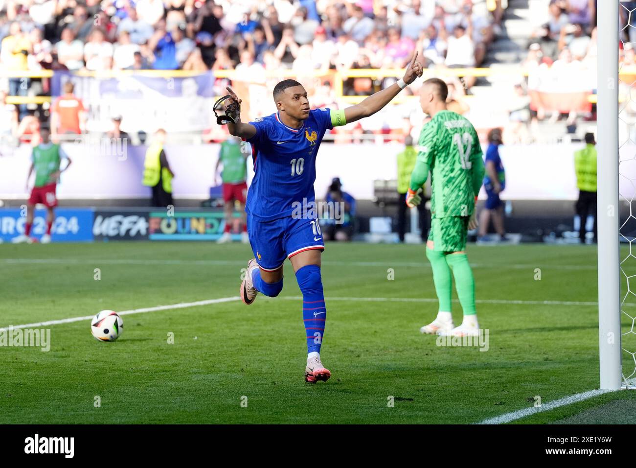 France's Kylian Mbappe takes off his protective face mask and ...