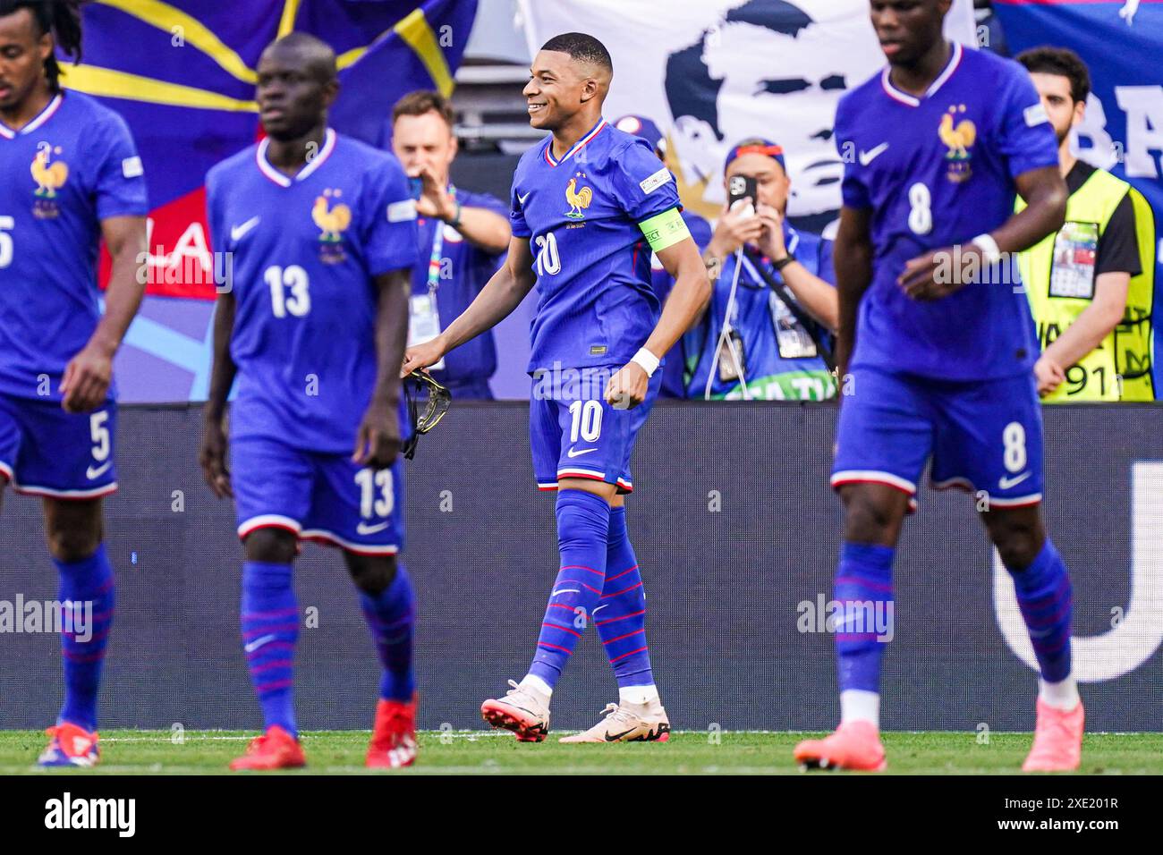DORTMUND, GERMANY - JUNE 25: Kylian Mbappe of France takes off his mask ...