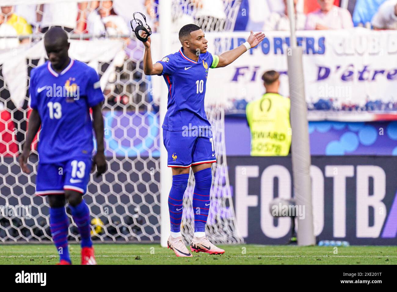 DORTMUND, GERMANY - JUNE 25: Kylian Mbappe of France takes off his mask ...