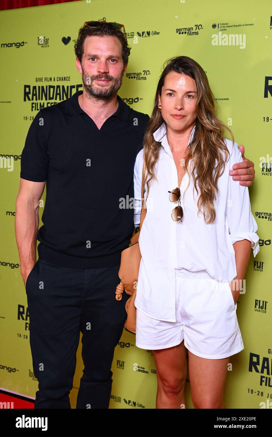 London, UK. 25 June 2024. Jamie Dornan and Amelia Warner attending the ...