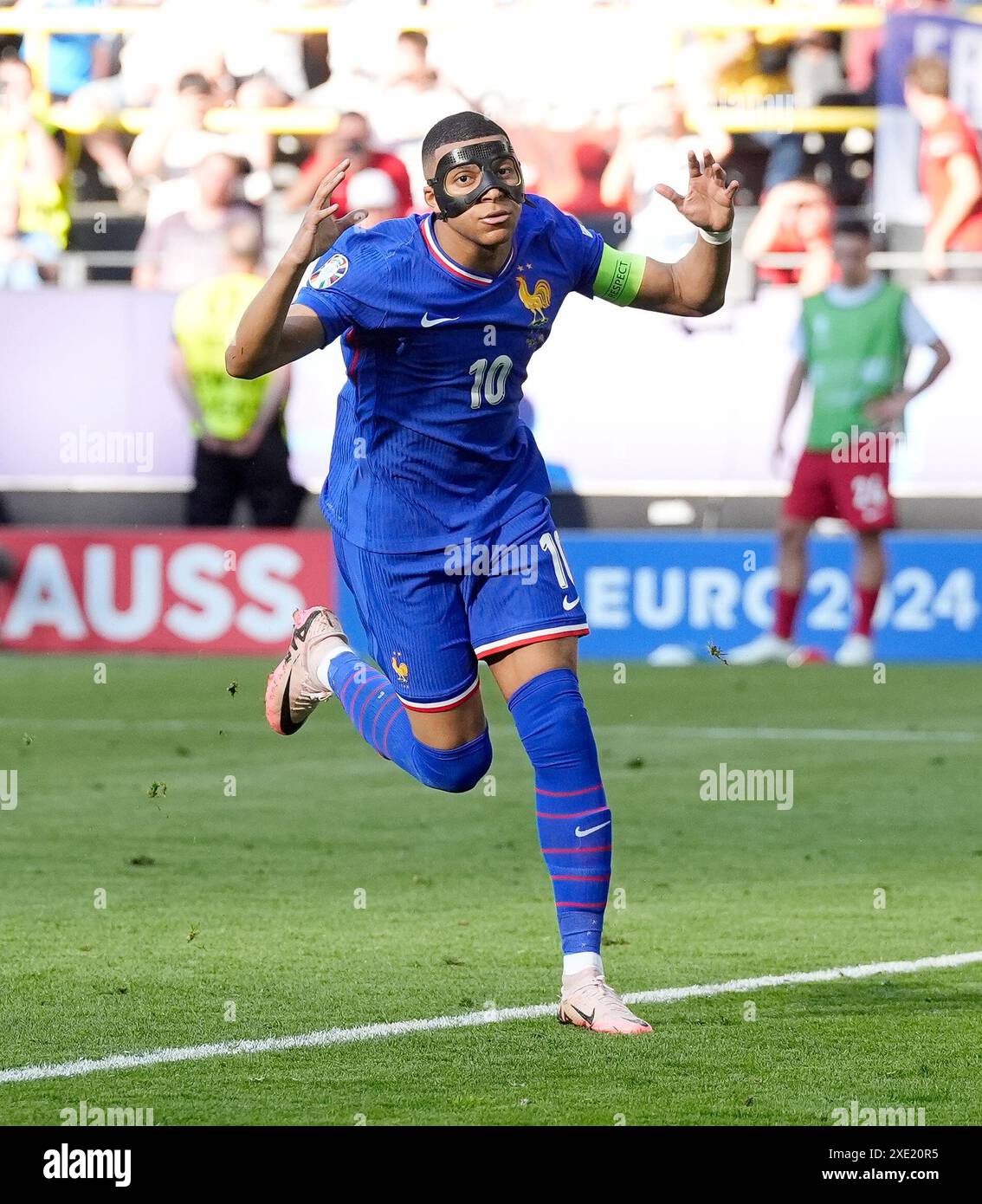 France's Kylian Mbappe, wearing a protective face mask, celebrates ...