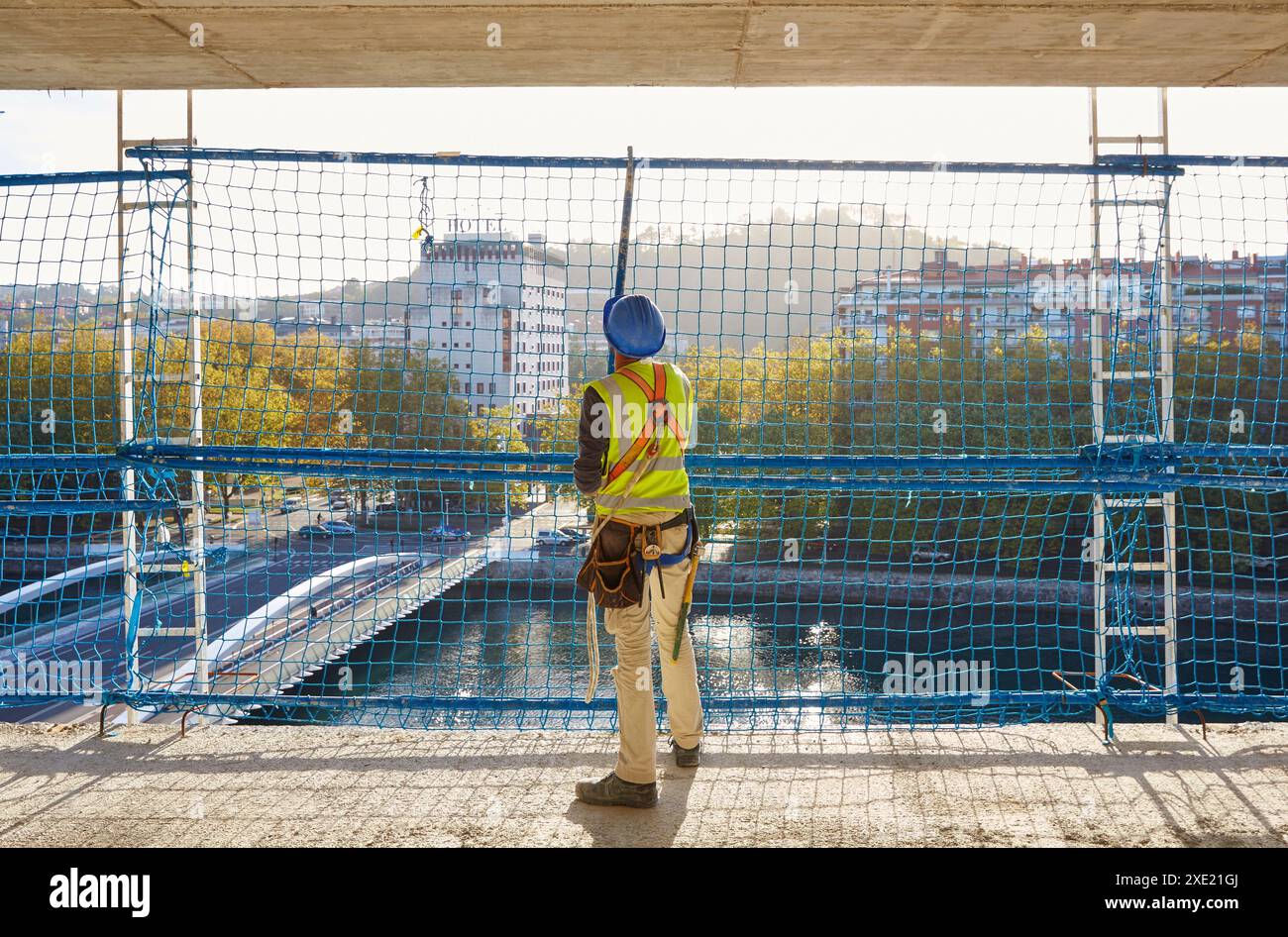 Worker placing Security System Work RESA. Protection in building work ...