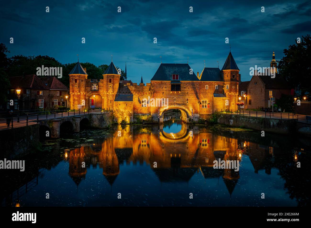 Medieval fortress city wall gate Koppelpoort and Eem River in the city ...