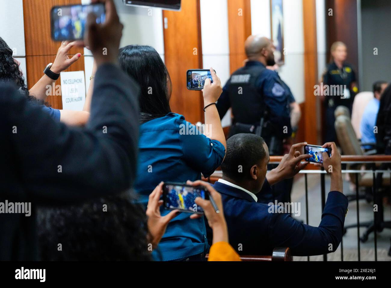 CORRECTS NAME: Reporters use their phones to take photos of Johan Jose ...