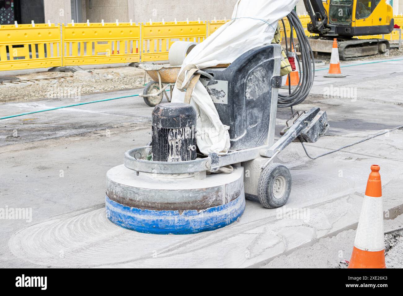 Grinding machine working on Concrete city road on construction site ...