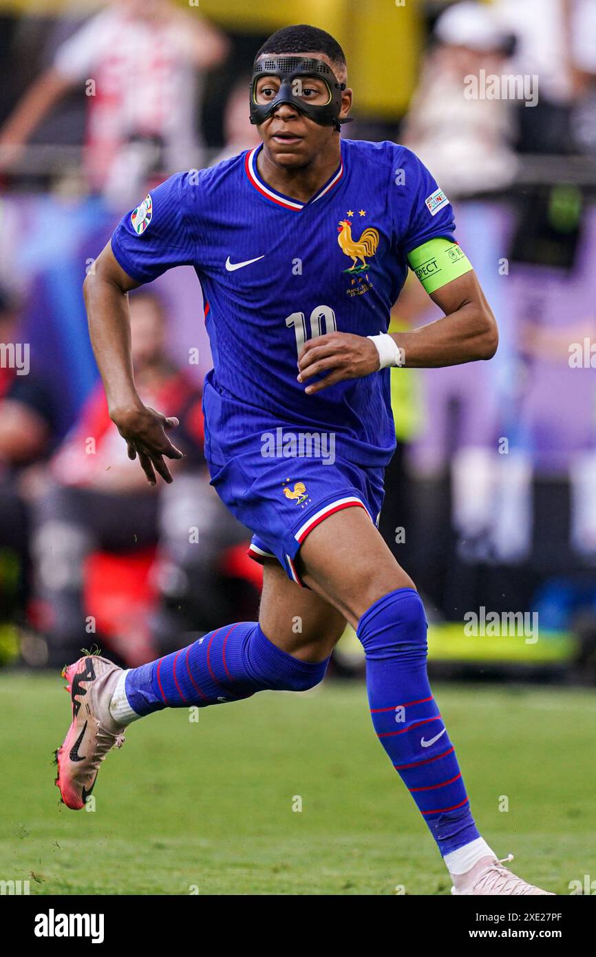 DORTMUND, GERMANY - JUNE 25: Kylian Mbappe of France with mask looks up ...